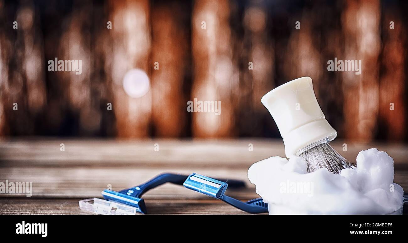 Shaving accessories on a wooden texture background. Tools. Disposable ...