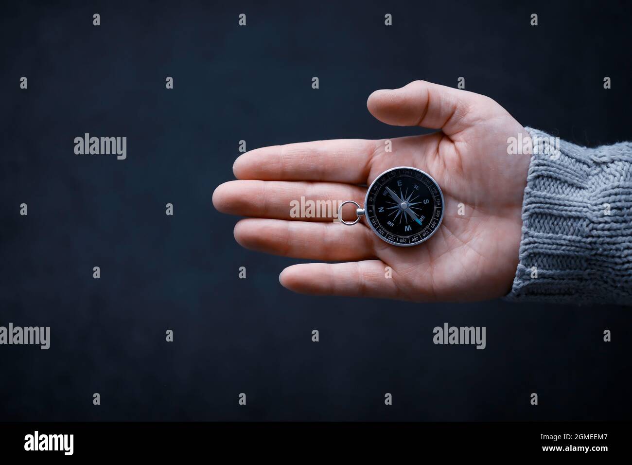 Travel concept. Magnetic compass in the hand. Retro navigator in hand ...