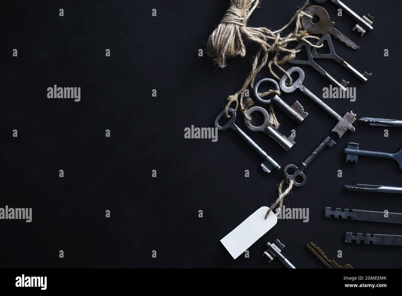 Set of vintage keys for lock. Retro keys on a dark stone background ...