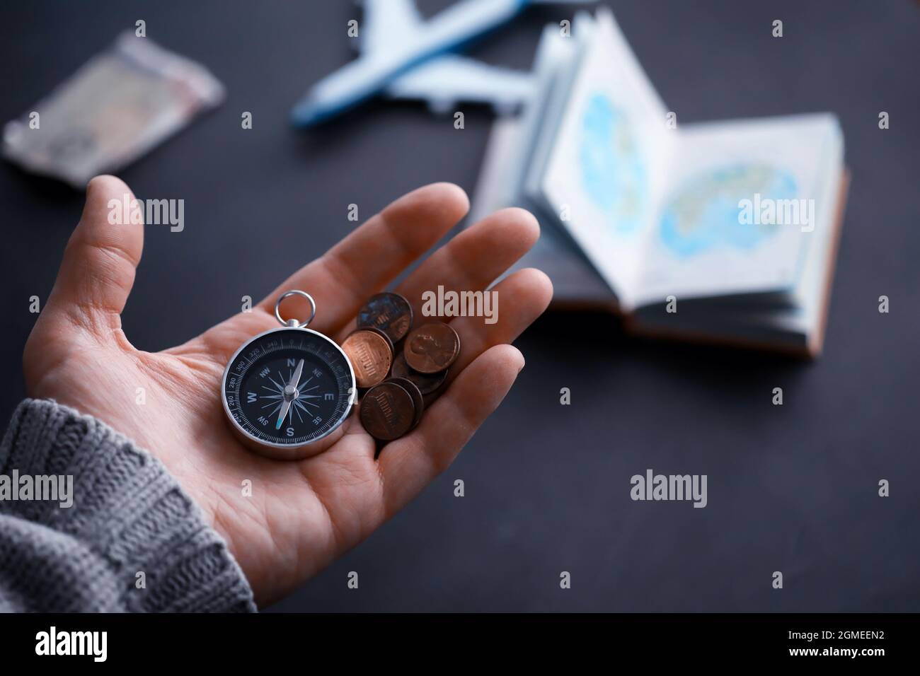 Travel concept. Magnetic compass in the hand. Retro navigator in hand ...