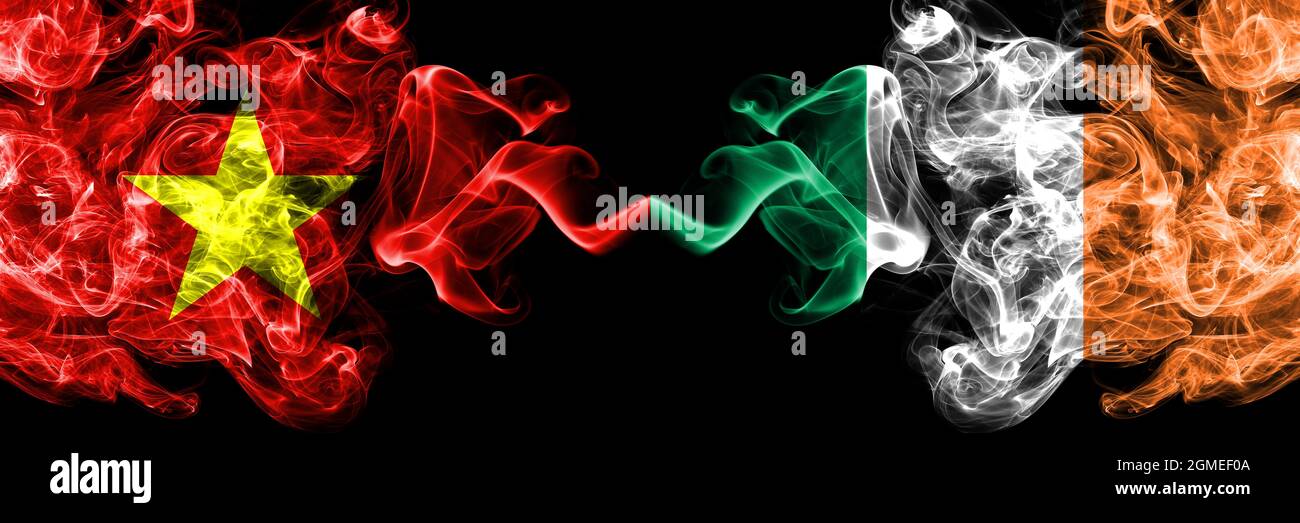 Vietnam, Vietnamese vs Ireland, Irish smoke flags side by side Stock ...