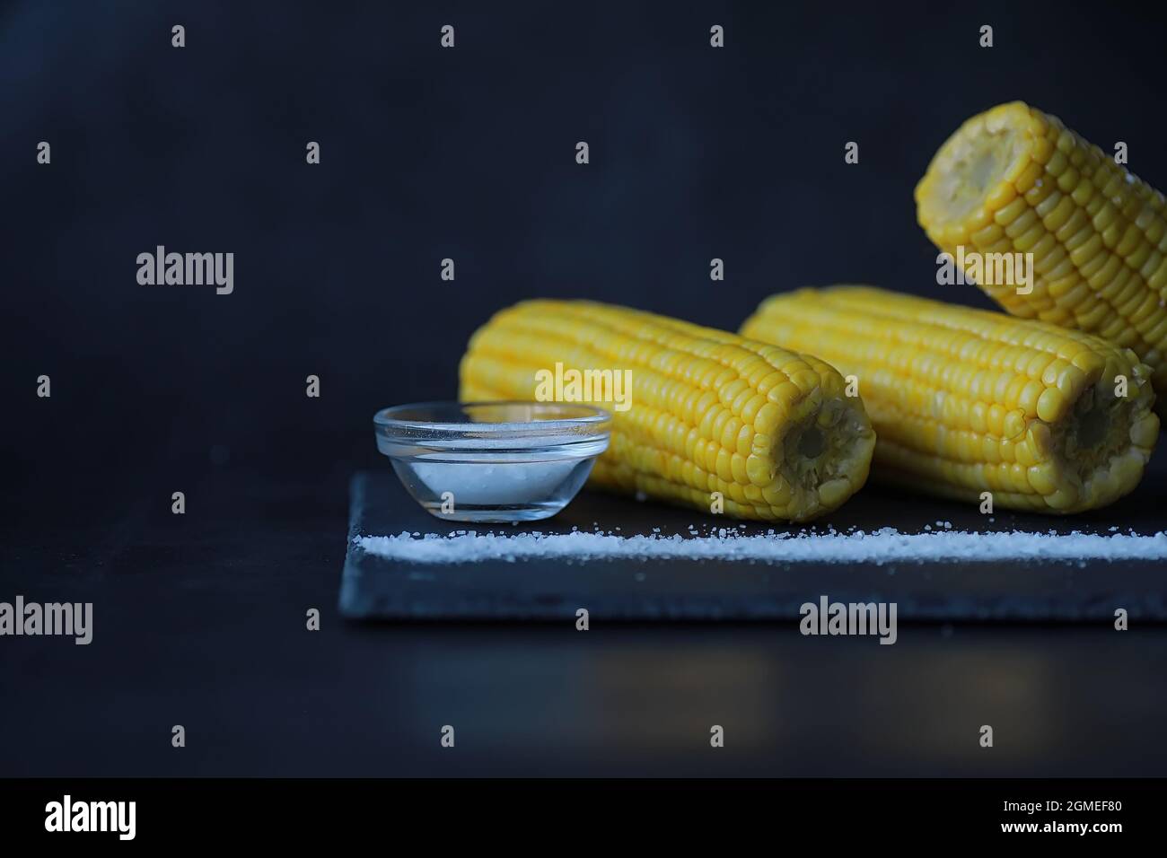Freshly made fragrant ear of corn with salt. Farm snack fresh corn ...