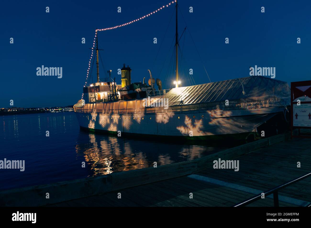 CSS Acadia at night with snow flake lights on it Stock Photo - Alamy