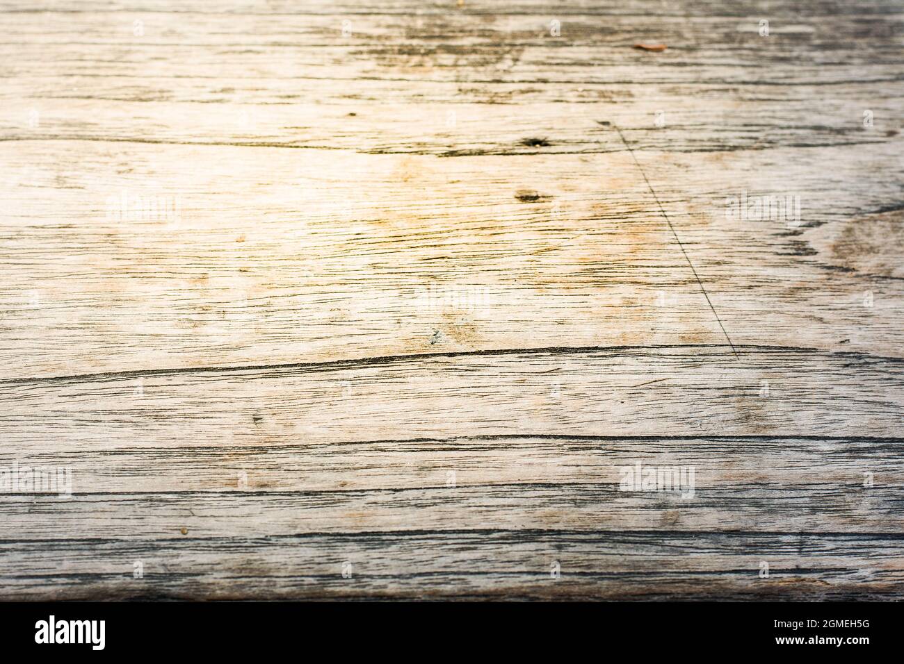 Wooden dining table with light screen Stock Photo - Alamy
