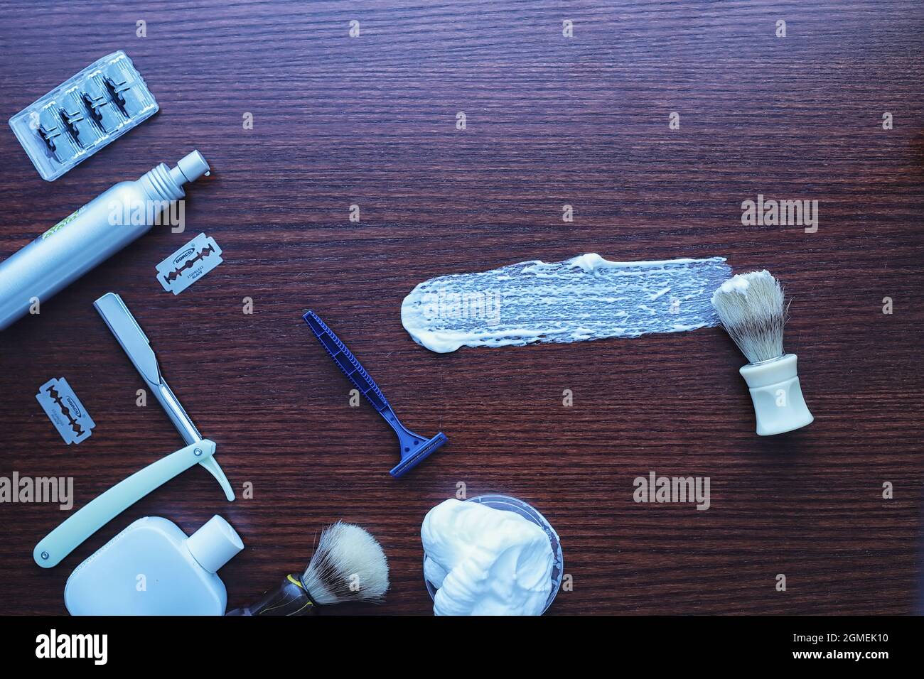Shaving accessories on a wooden texture background. Tools. Disposable ...