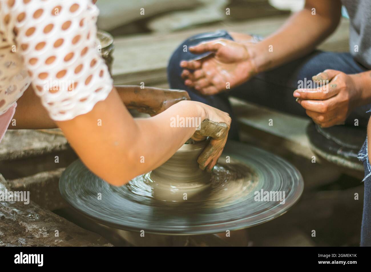 Clay making workshop, women using pottery wheel at Koh Kret, Nonthaburi ...