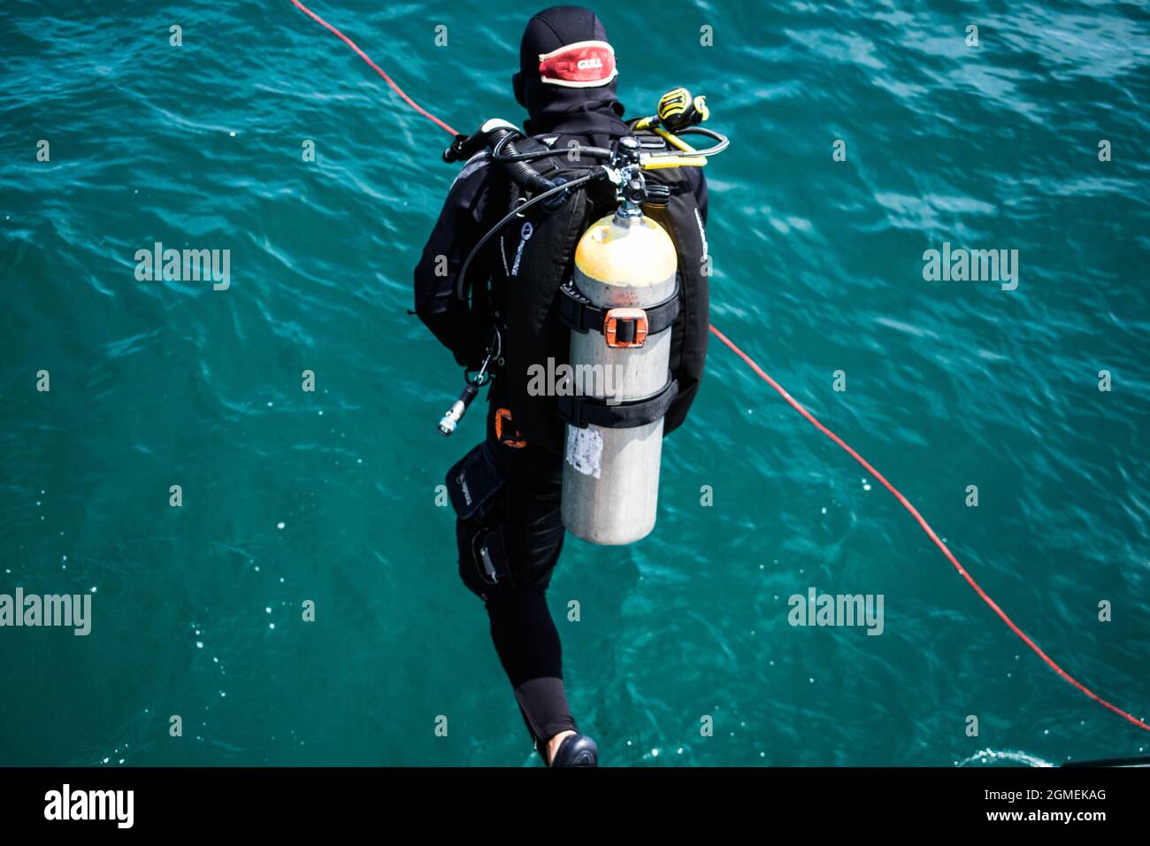 Man suit jumping blue hi-res stock photography and images - Alamy