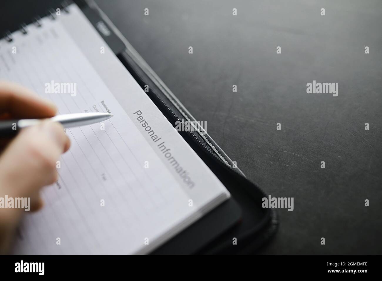 Filling out a form with personal information. Documents in a folder on ...