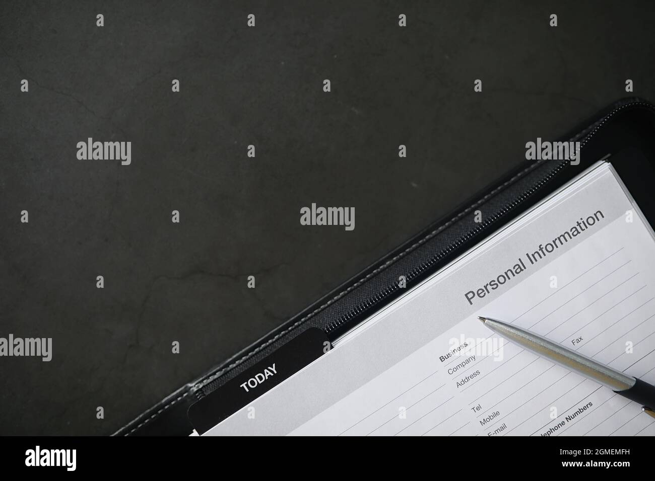 Filling out a form with personal information. Documents in a folder on ...