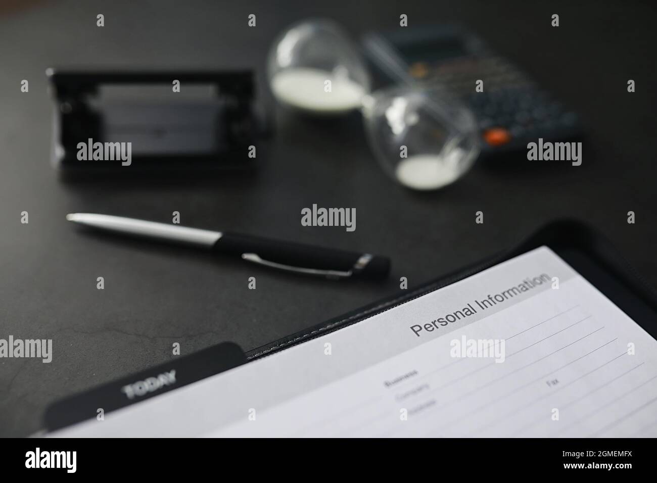 Filling out a form with personal information. Documents in a folder on ...