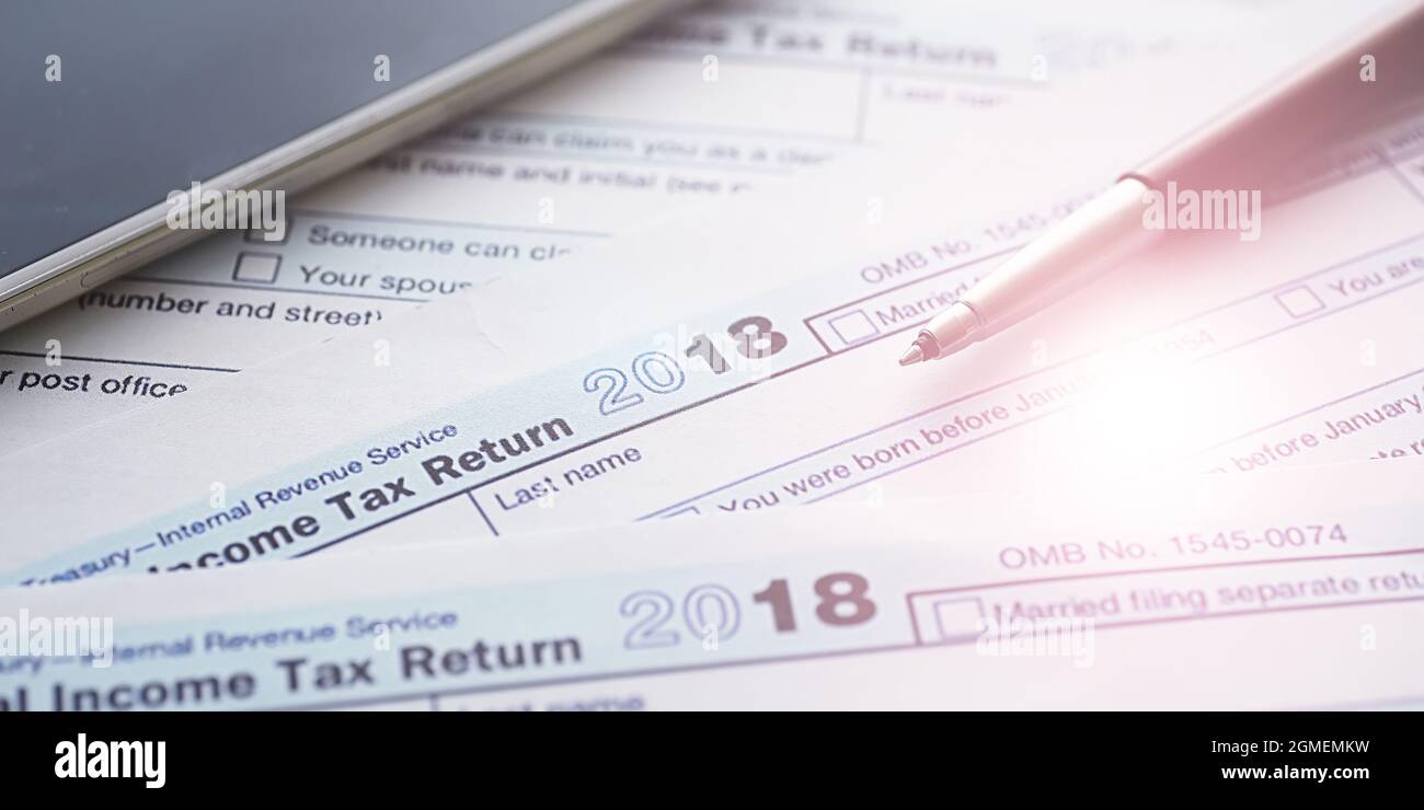 Annual tax reporting. Tax form on the table. Financial statements ...