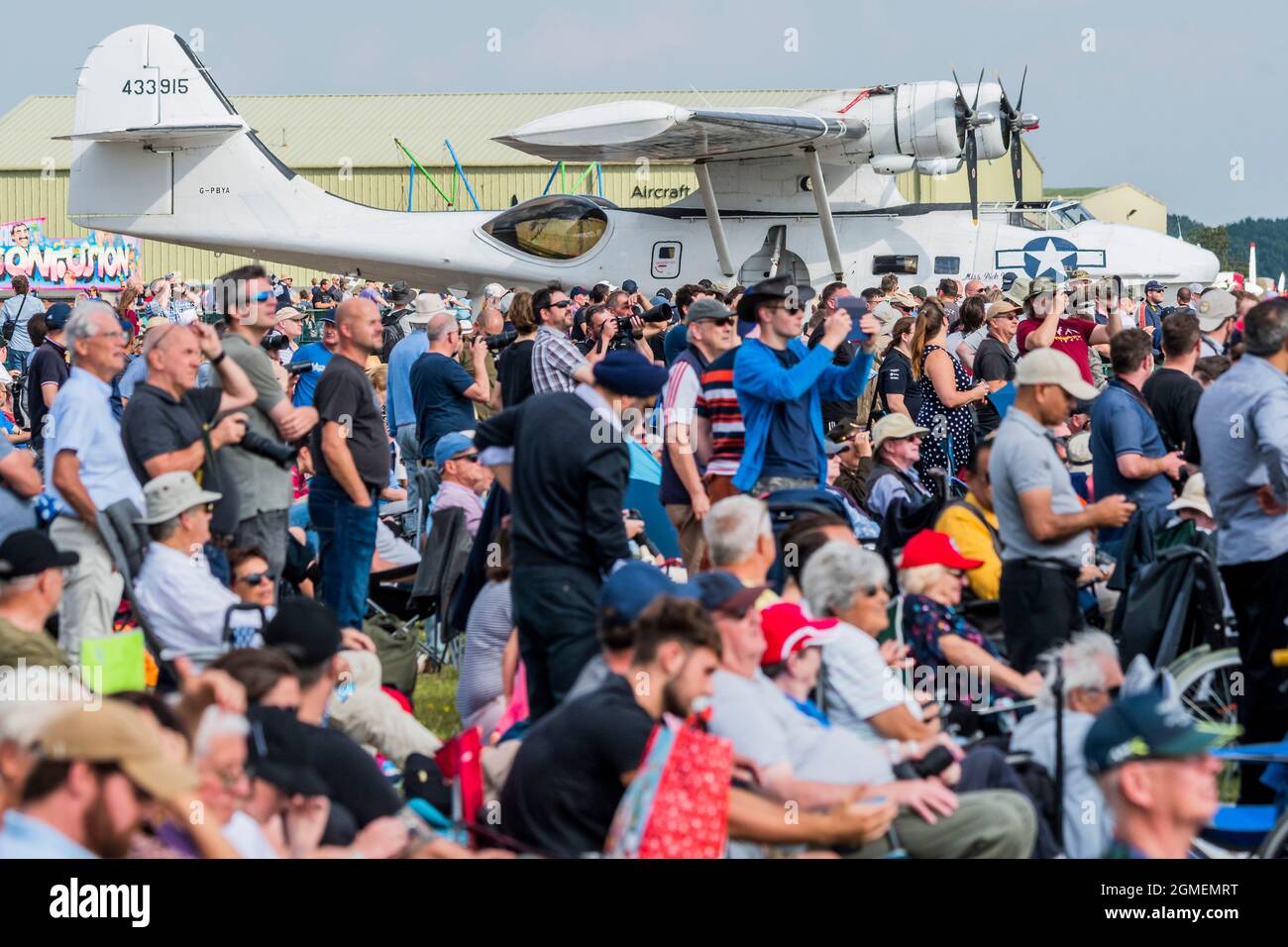 Duxford, UK. 18th Sep, 2021. A crowd of aircraft enthusiasts strains to ...
