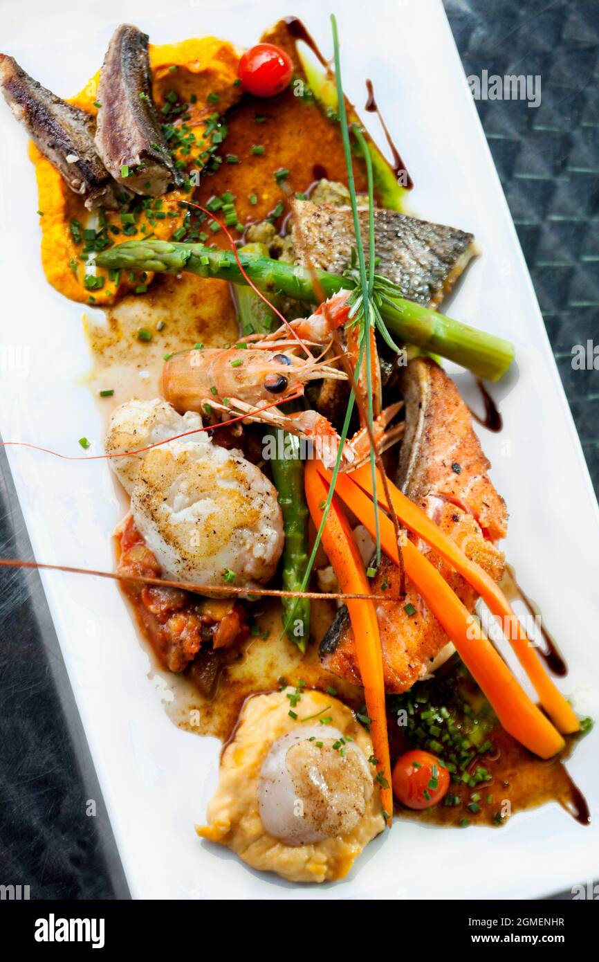 Various fish fillets with vegetable puree abd crustacean Stock Photo ...