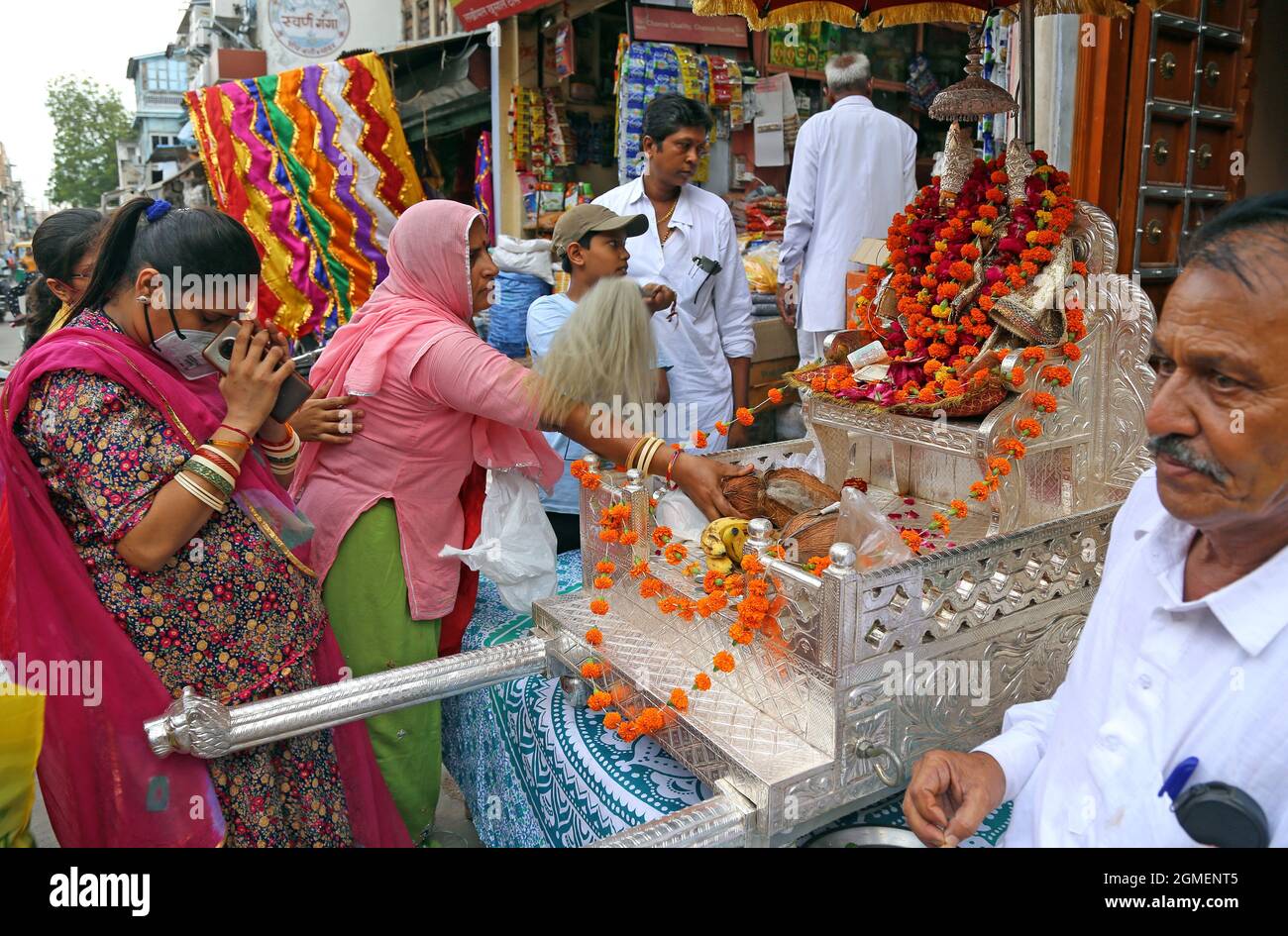 Hindu devotees offer prayers to Lord Krishna and Goddess Radha at a ...