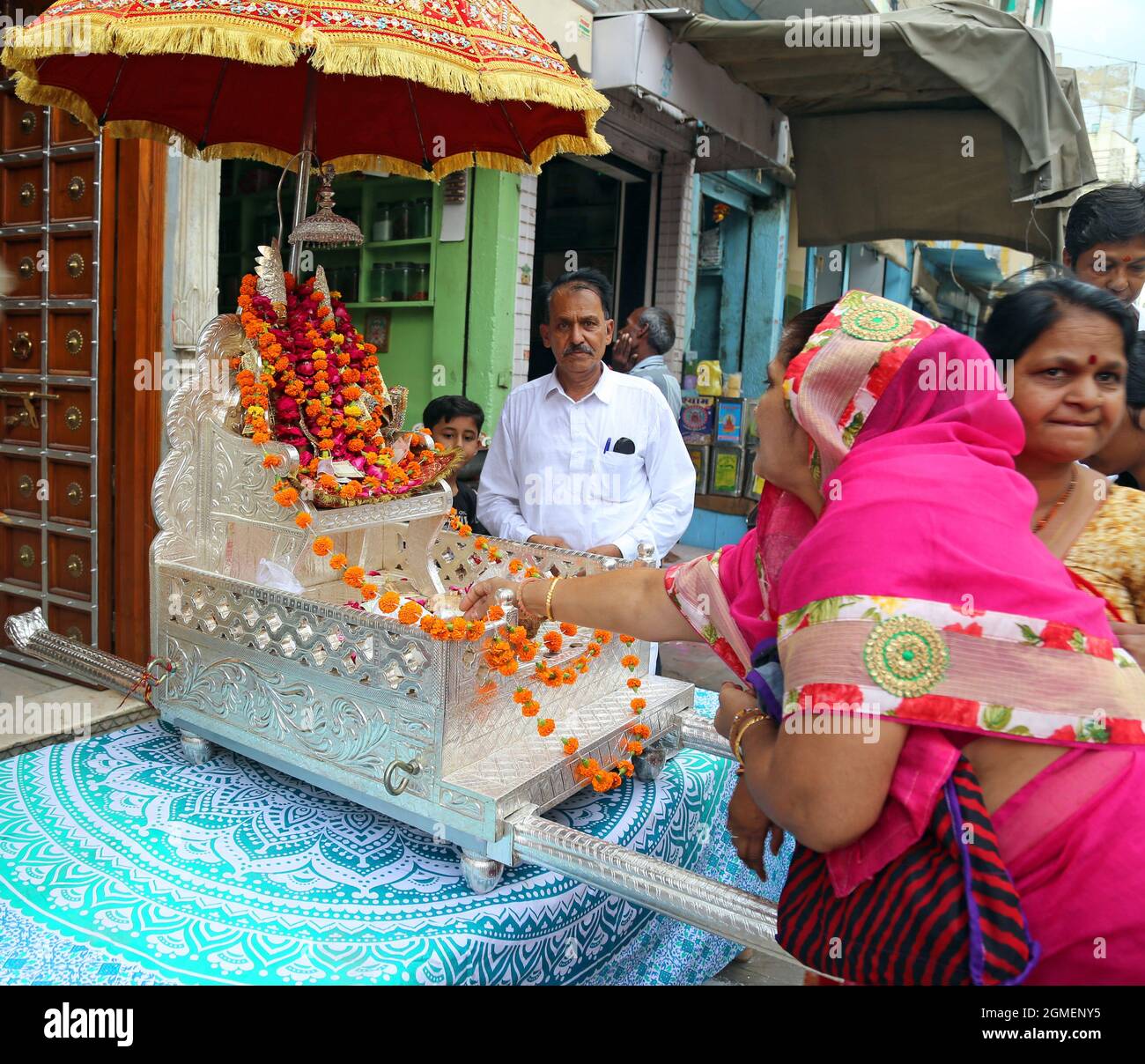 Hindu devotees offer prayers to Lord Krishna and Goddess Radha at a ...