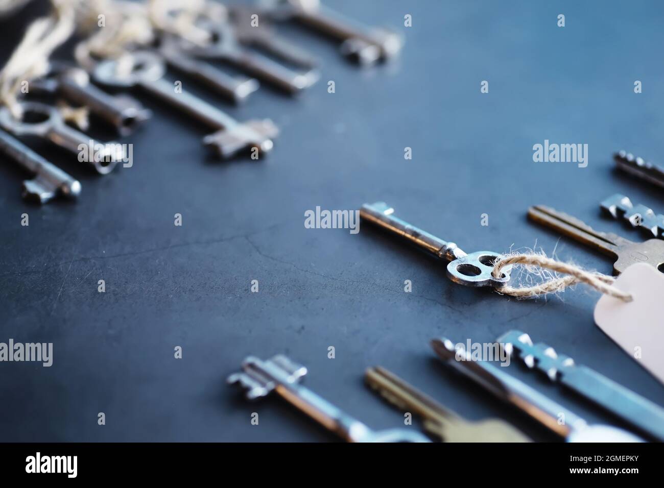 Set of vintage keys for lock. Retro keys on a dark stone background ...