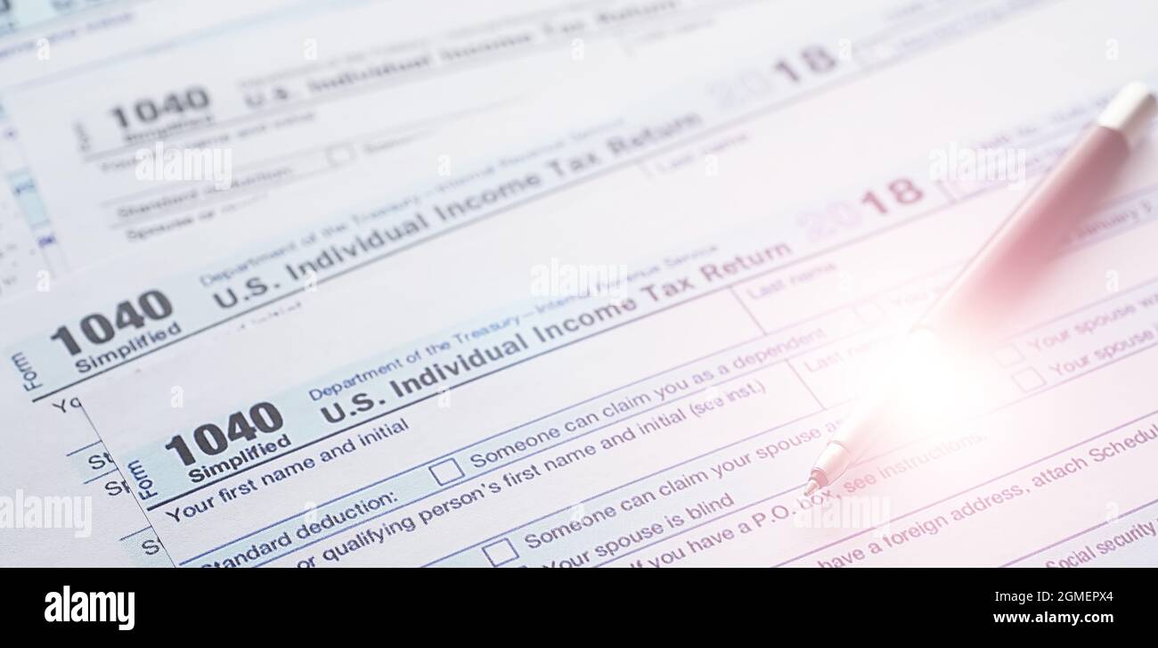 Annual tax reporting. Tax form on the table. Financial statements ...