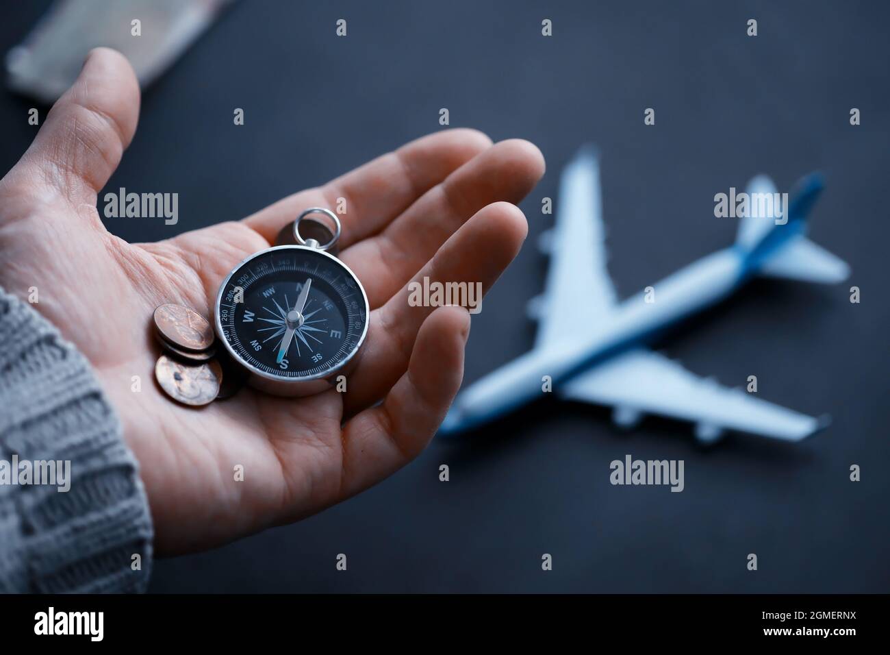 Travel concept. Magnetic compass in the hand. Retro navigator in hand ...