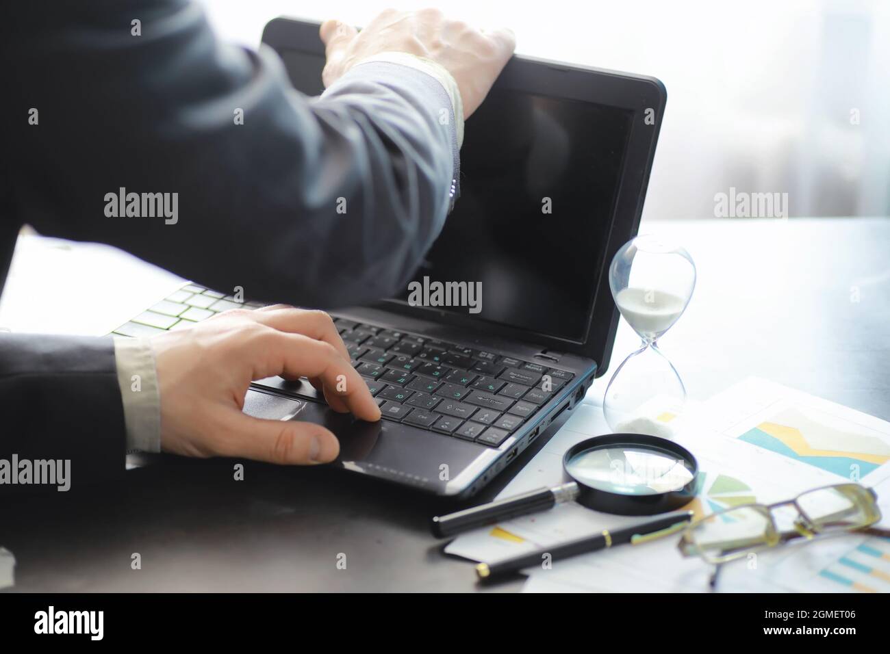 Working time symbolizes an hourglass. Office desk with insurance ...