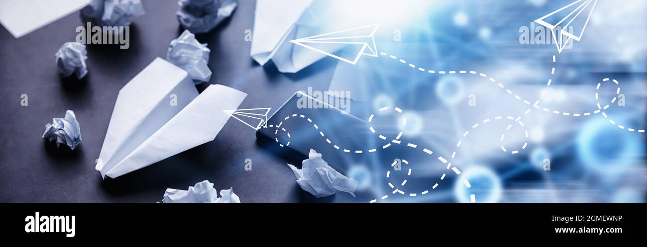 Paper airplane on the table. Origami model on a dark background ...