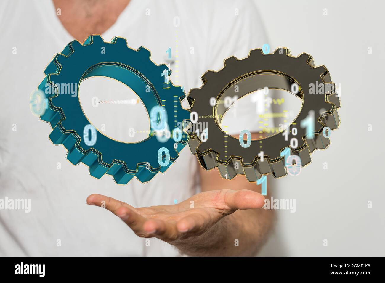 Businessman hand and gears as a symbol of success Stock Photo - Alamy