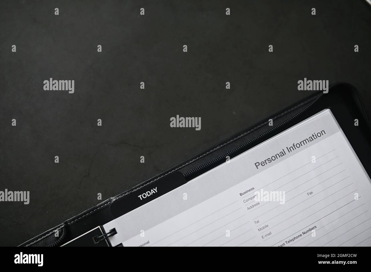 Filling out a form with personal information. Documents in a folder on ...