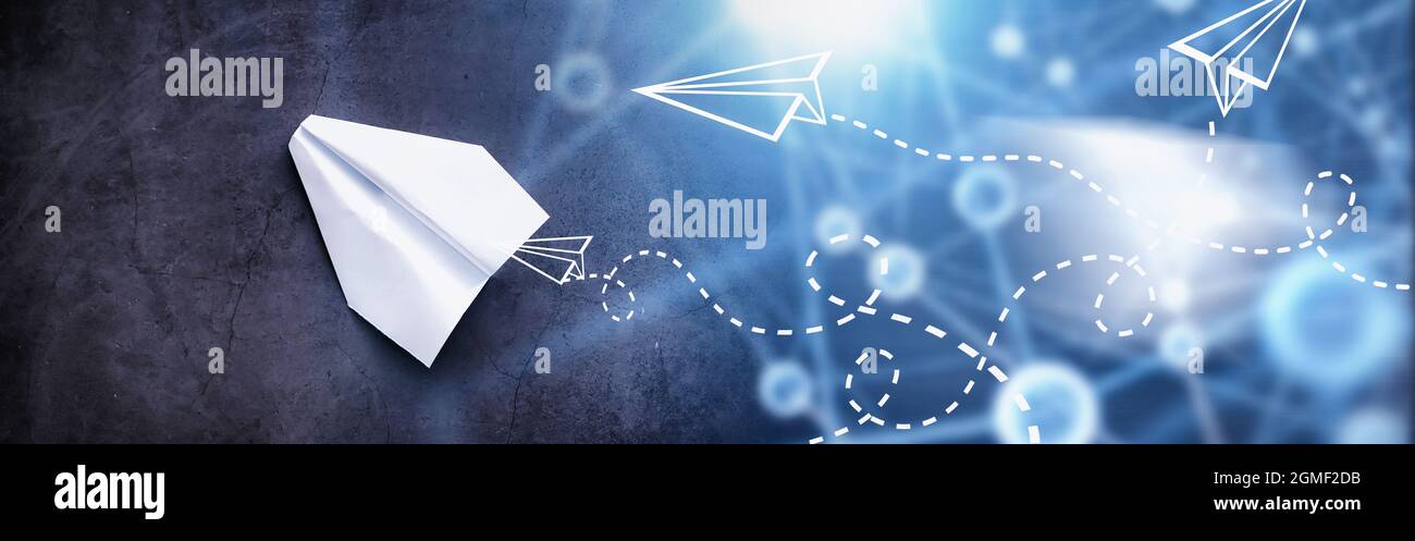 Paper airplane on the table. Origami model on a dark background ...