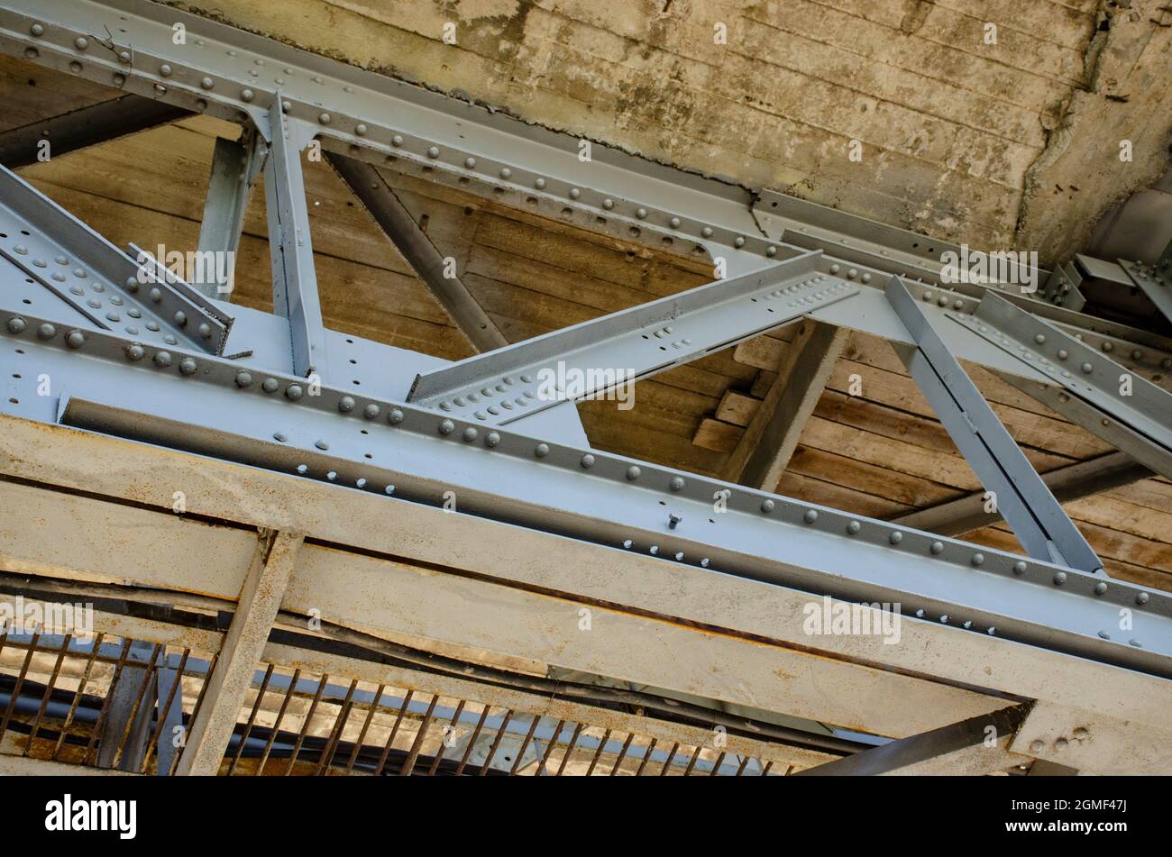 Metal structures under the bridge, large metal bridge over water. View ...