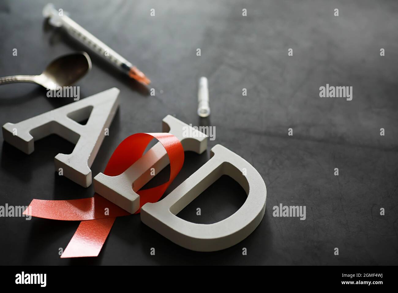 Symbol of human immunodeficiency virus disease. Red ribbon. A helping ...