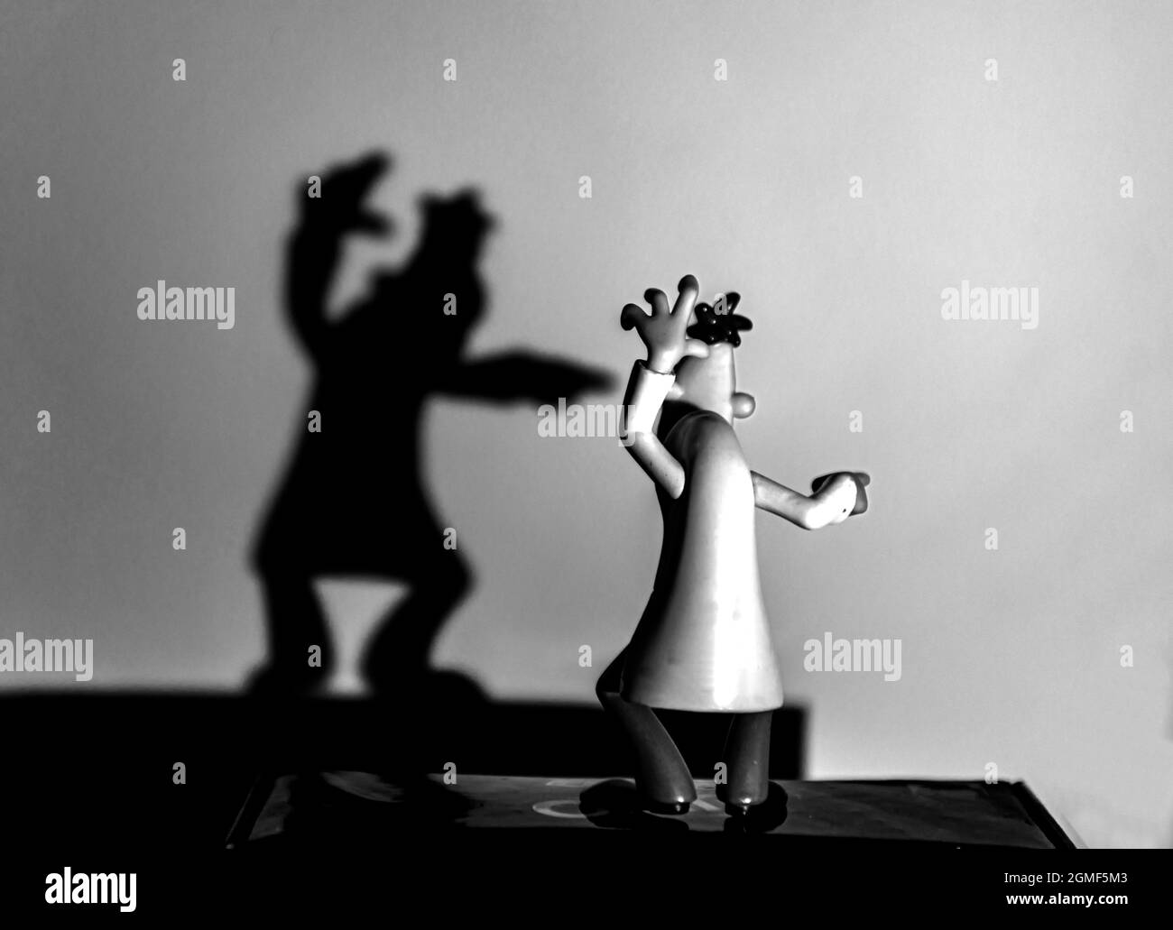 object fighting with its shadow on the wall Stock Photo - Alamy