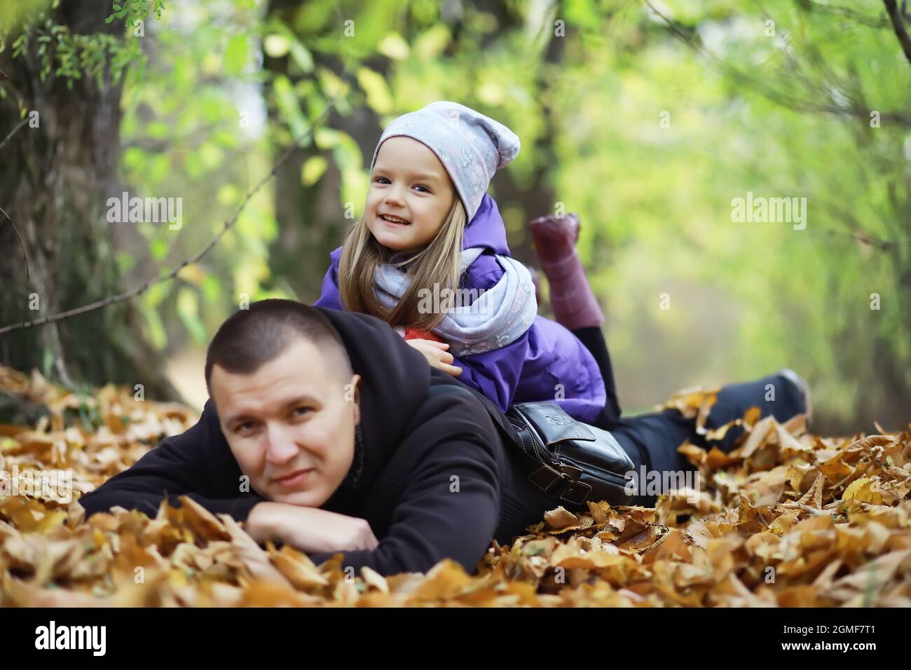 Children for a walk in autumn park. Leaf fall in the park. Family. Fall ...