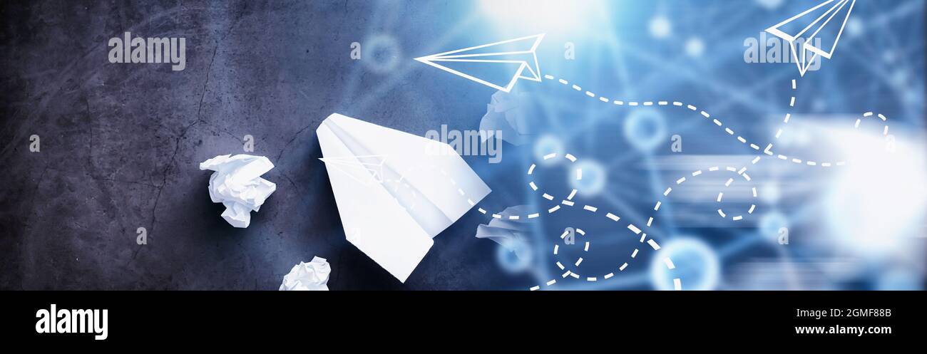 Paper airplane on the table. Origami model on a dark background ...