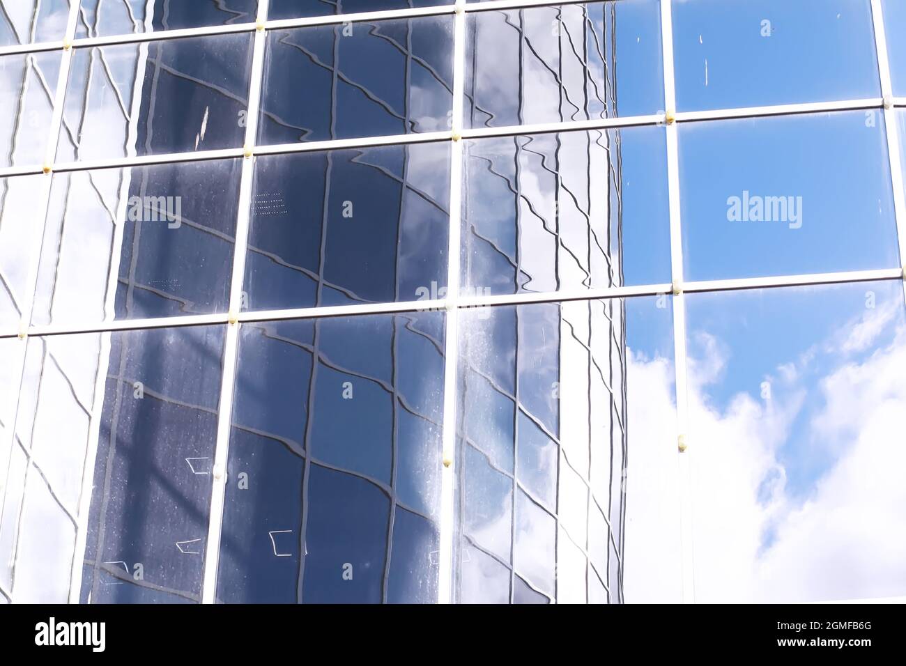 Architectural detail of the facade with multiple reflections of other ...