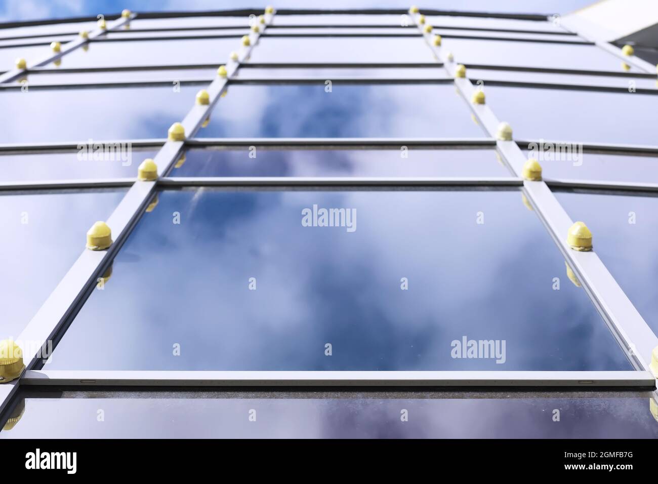 Architectural detail of the facade with multiple reflections of other ...