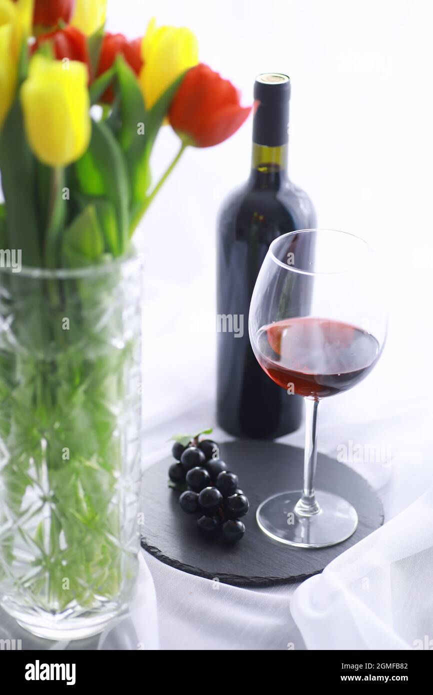 Glass with grape red semi-dry wine. Valentine's day concept background ...