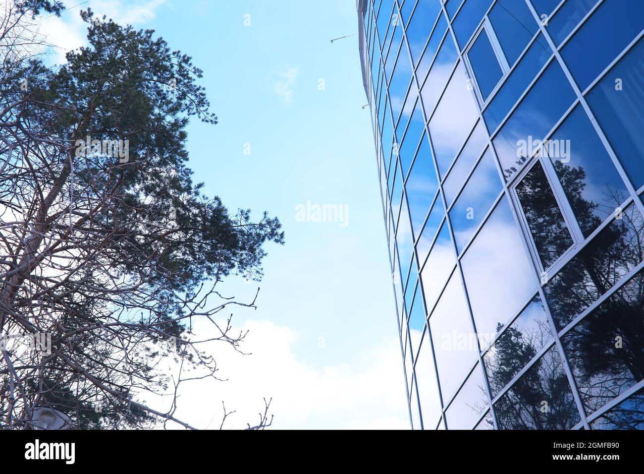 Architectural detail of the facade with multiple reflections of other ...