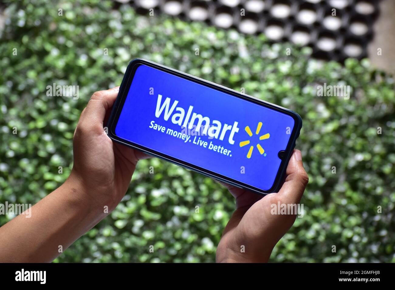 New Delhi, India - 13 September, 2019: using walmart app on smartphone ...