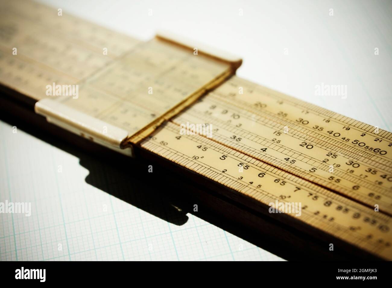 Logarithmic slide rule on piece of graph paper Stock Photo - Alamy