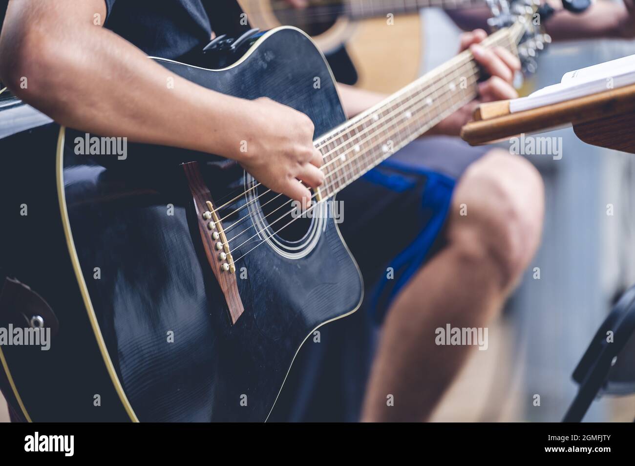Christian person playing the guitar at a religious ceremony in a church ...