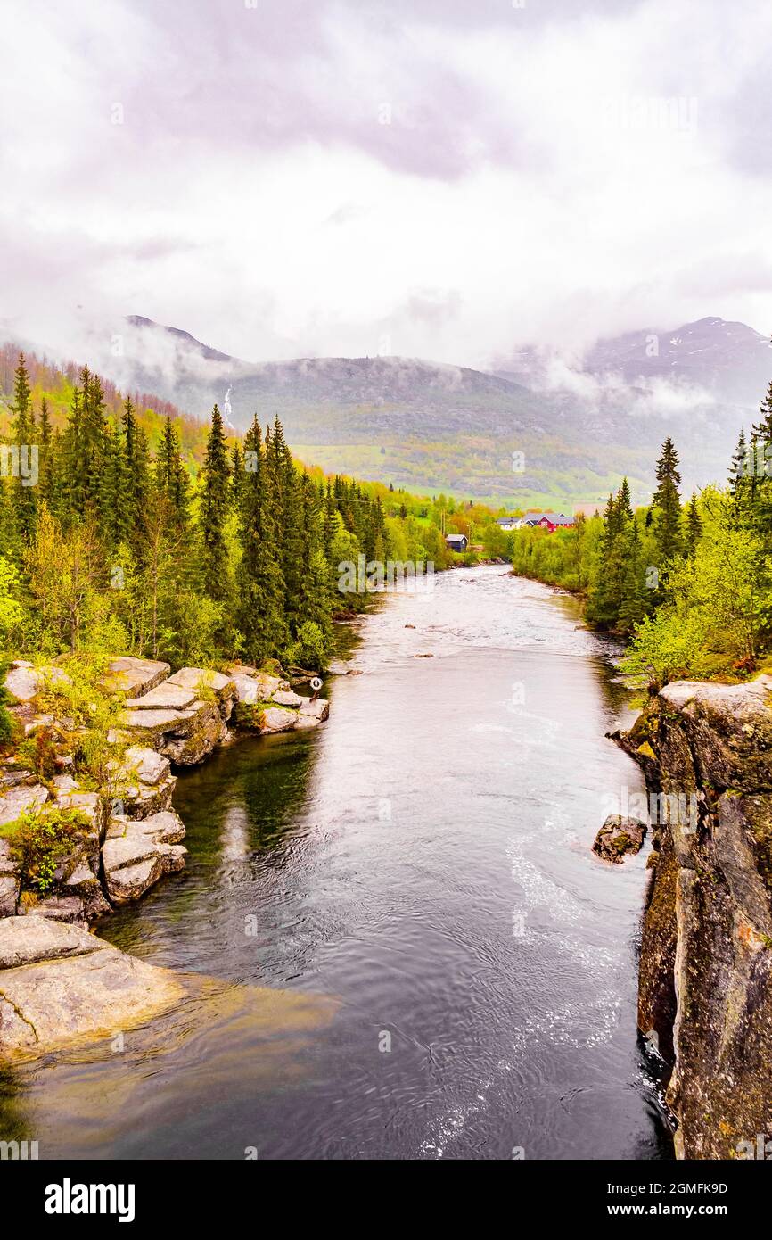 River of the beautiful waterfall Rjukandefossen with mountain and ...