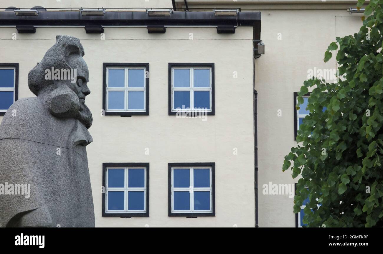 statue of a person in front of windows, Bergen, Norway Stock Photo - Alamy