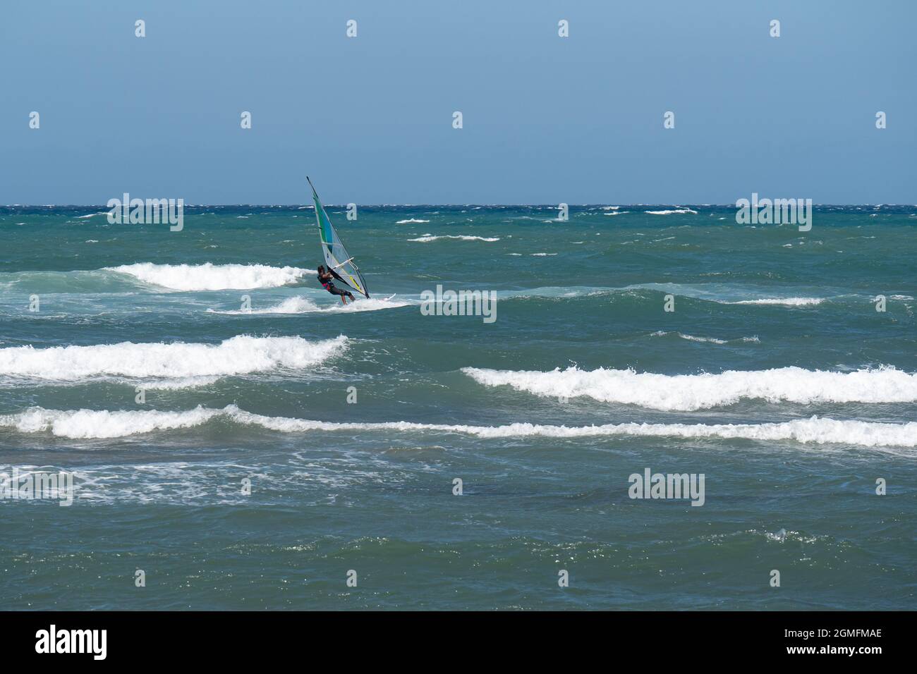 Windsurf Riding the Waves in a Choppy Sea Stock Photo - Alamy