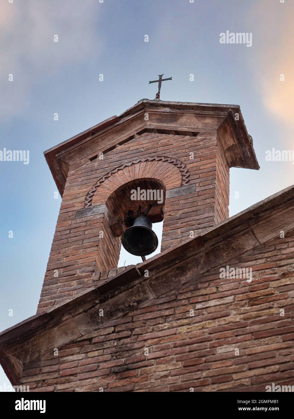 Detail of a Small Iron Bell under a Masonry Arch of a Church in the ...