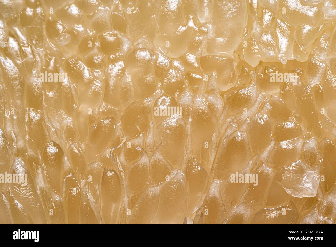Citrus fruit peeled. The inside of the fruit in close-up. An abstract ...
