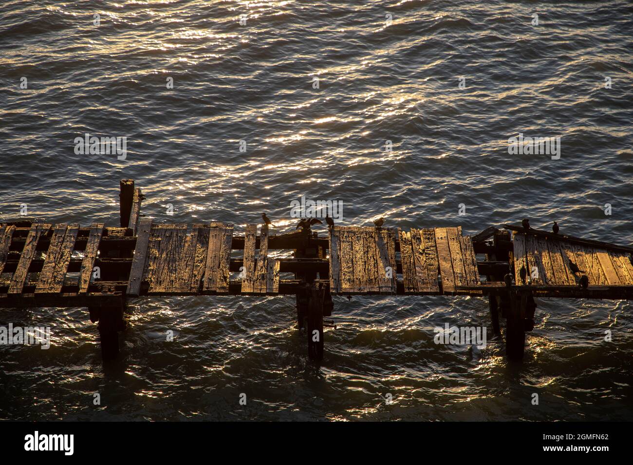 Old wooden pier on the beach Stock Photo - Alamy