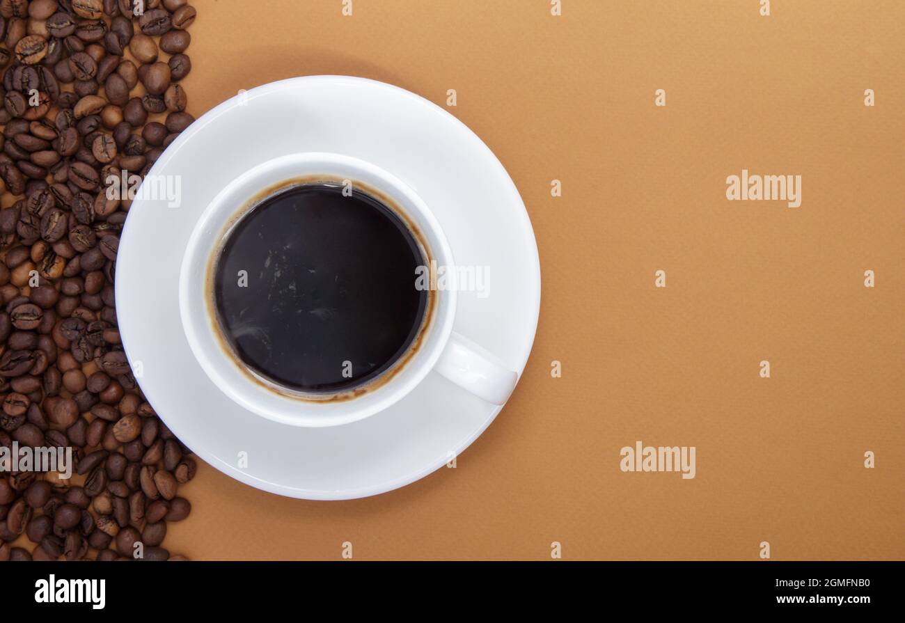 White cup of Americano black coffee without milk with a bunch of ...