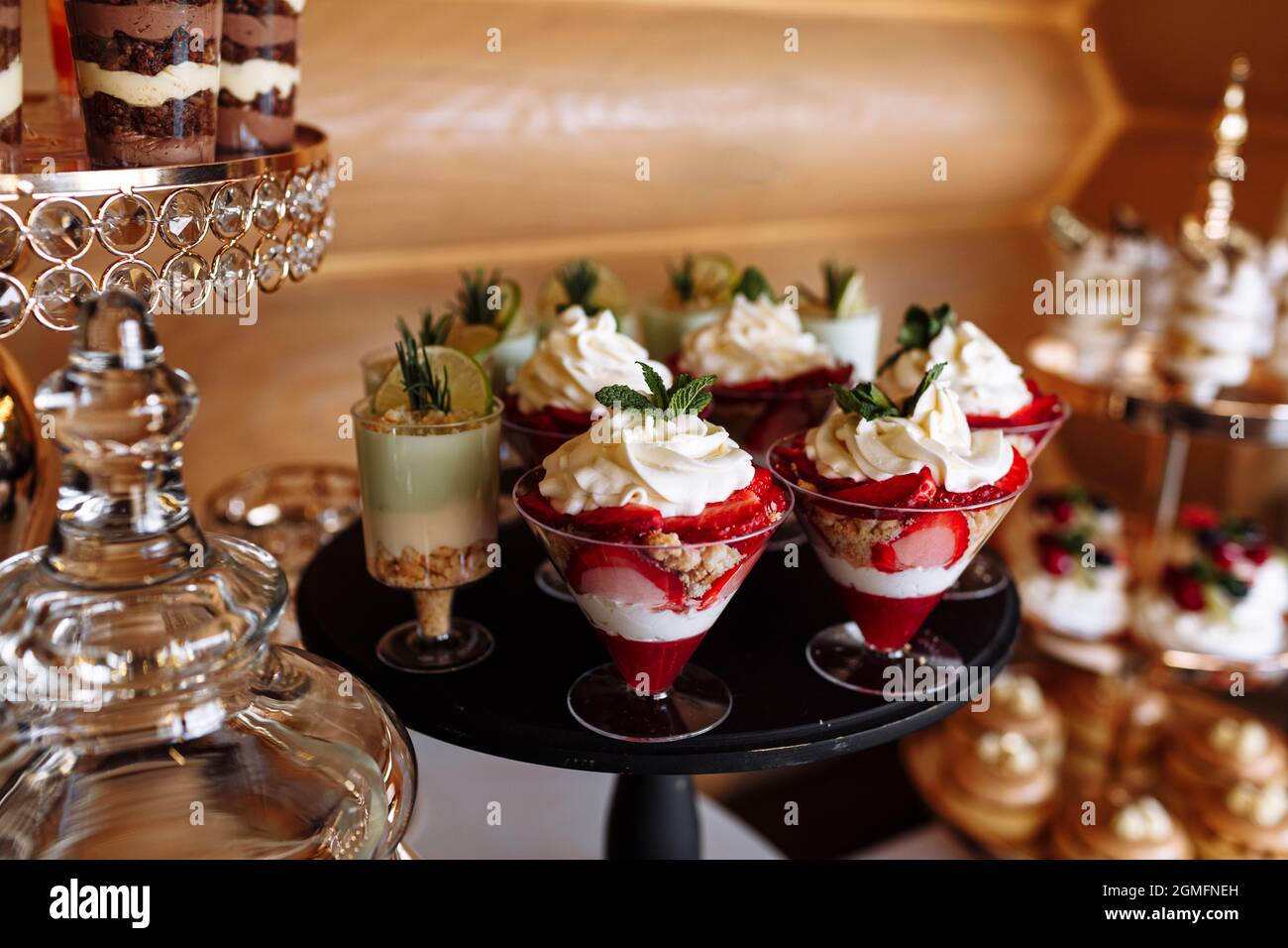 luxury wedding catering, table with modern desserts, cupcakes, sweets ...