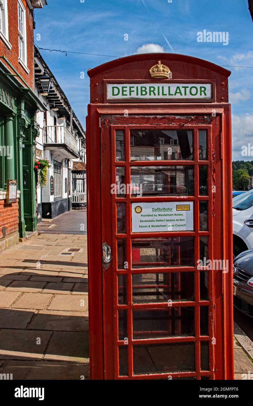 Red telephone box reused for defibrillator equipment Stock Photo - Alamy