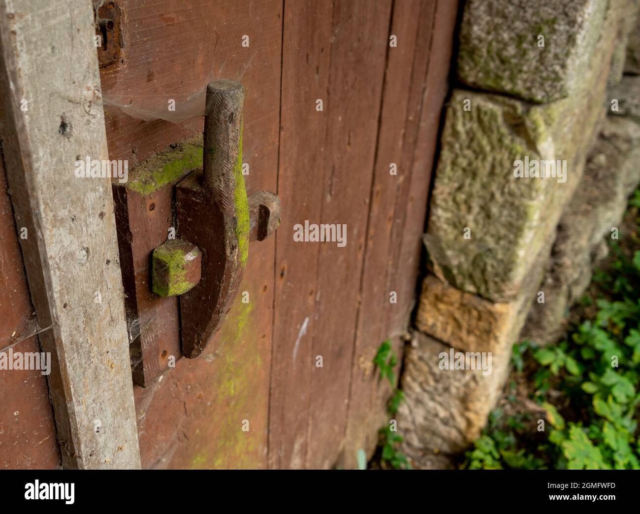 wooden lock on a brown door Stock Photo - Alamy