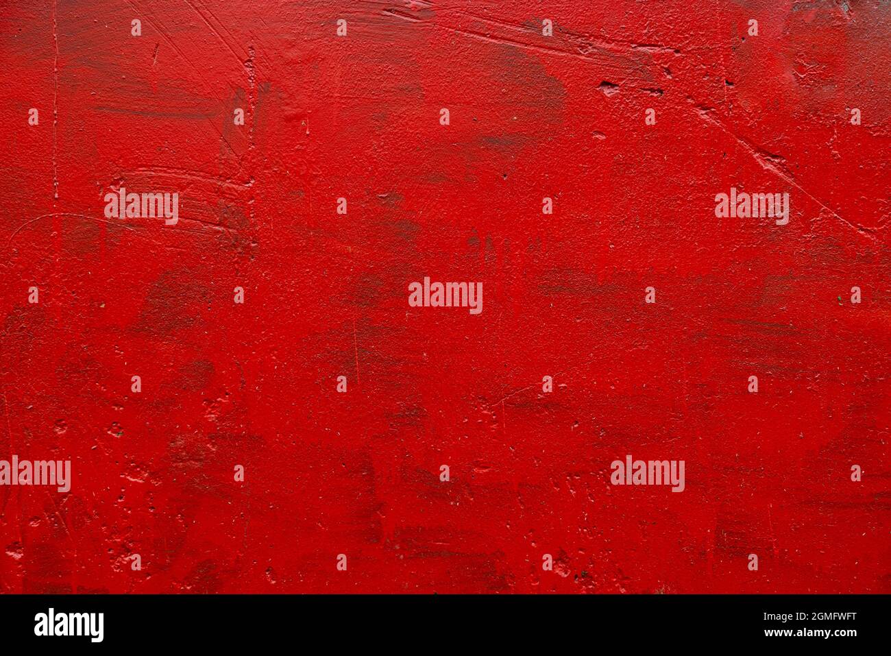 carelessly painted red flat surface - texture and full frame background ...